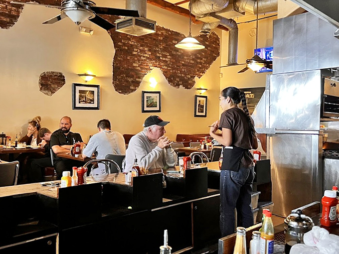 The servers here don't just bring food&mdash;they deliver experiences. That knowing smile says, "Yes, you'll need a box for the leftovers."