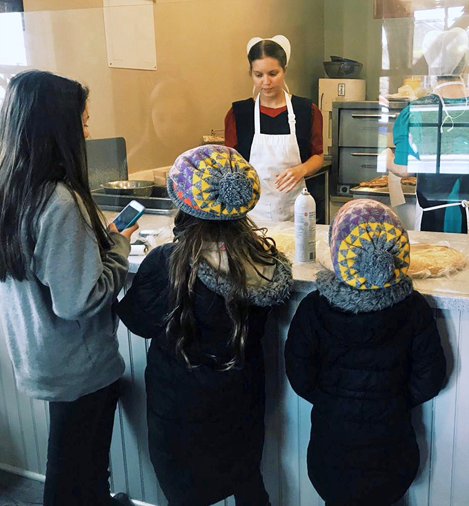 Cultural exchange at its finest&mdash;visitors learning the ways of the pretzel from those who know it best.