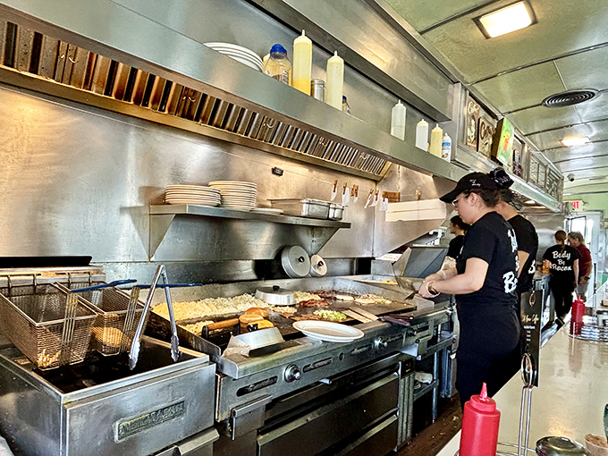 Behind the scenes, the kitchen crew orchestrates a beautiful ballet of breakfast preparation. Those griddles have seen more action than Broadway itself.