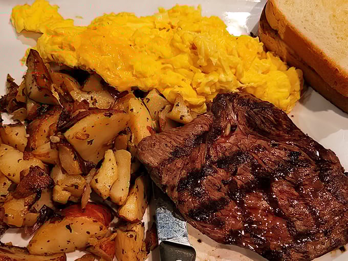 The breakfast of champions: perfectly seared steak, sunshine-yellow eggs, and potatoes that clearly didn't come from a freezer bag.