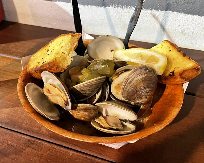 Steamed clams swimming in garlicky broth&mdash;a wooden bowl of treasures that would make Neptune himself order seconds.