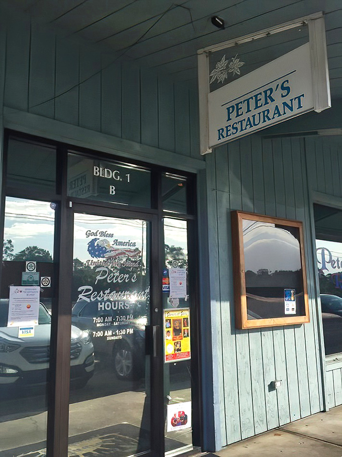 The blue exterior and welcoming entrance promise homestyle cooking inside—like finding a secret dining room attached to your favorite neighbor's kitchen.