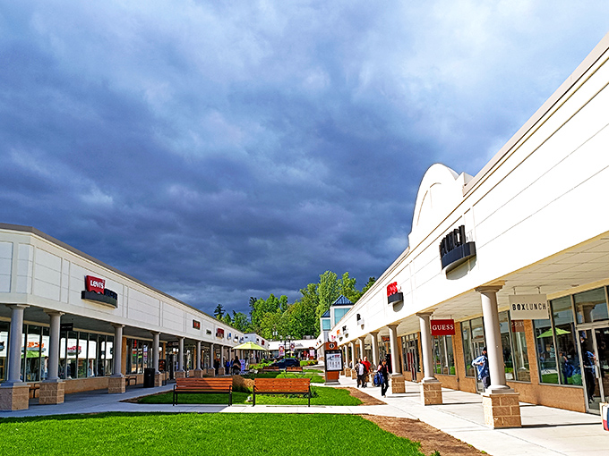 Between storm clouds and storefronts, shoppers navigate the pedestrian-friendly layout that makes marathon bargain-hunting actually pleasant.