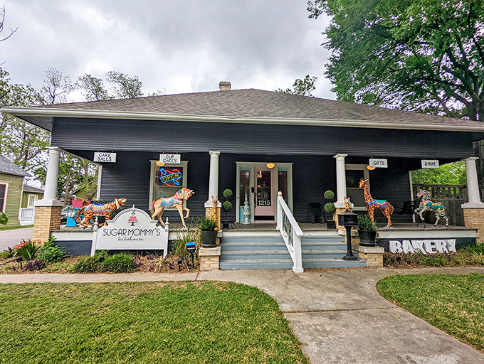 Sugar Mommy's Bakehouse proves that sometimes the sweetest treasures hide in unassuming craftsman cottages, with colorful horses standing guard over the calories within.