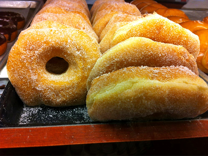 Sugar-dusted donuts standing at attention, waiting to be drafted into your breakfast lineup. The powdery battalion never disappoints.
