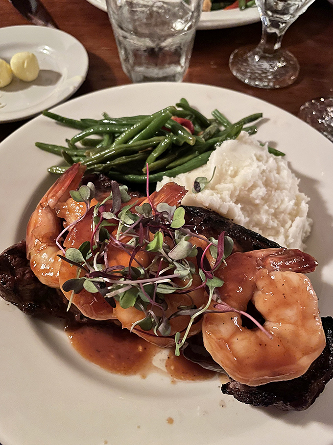Surf meets turf in this elegant plate where plump shrimp and tender steak compete for your attention like delicious rivals.