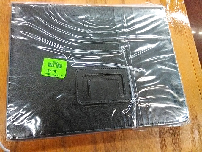 Even brand new items occasionally appear, like this tablet case still in original packaging&mdash;thrift store equivalent of finding money.