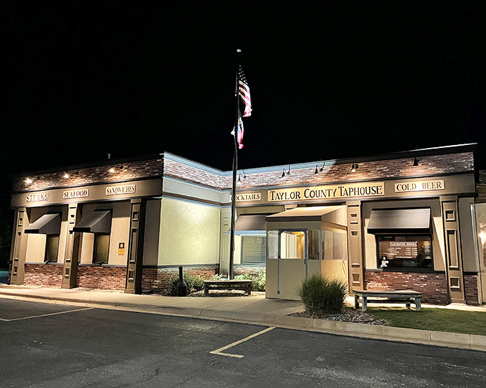 Taylor County Taphouse glows invitingly after dark, its illuminated fa&ccedil;ade promising craft beers, hearty meals, and the warm buzz of community gathering.