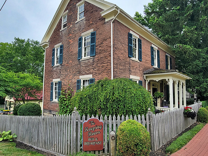 The Keeping Room B&B behind its white picket fence is the architectural equivalent of a warm cookie—classic, comforting, and impossible to resist.