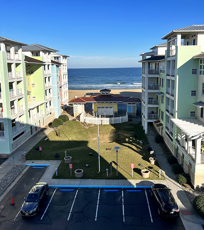 The Sanctuary's pastel condos frame a perfect ocean view, proving that sometimes the best things in life are between buildings.