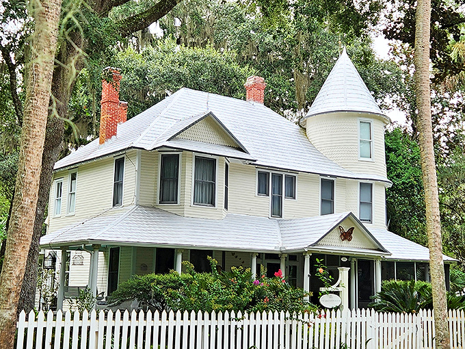 The Simonton House stands like a Victorian postcard come to life, its white picket fence and wrap-around porch practically begging for lemonade sippers. 