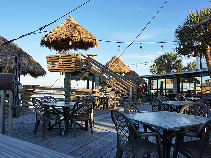 These elevated tiki huts aren't just dining areas&mdash;they're front-row seats to the daily water ballet of boats and birds.