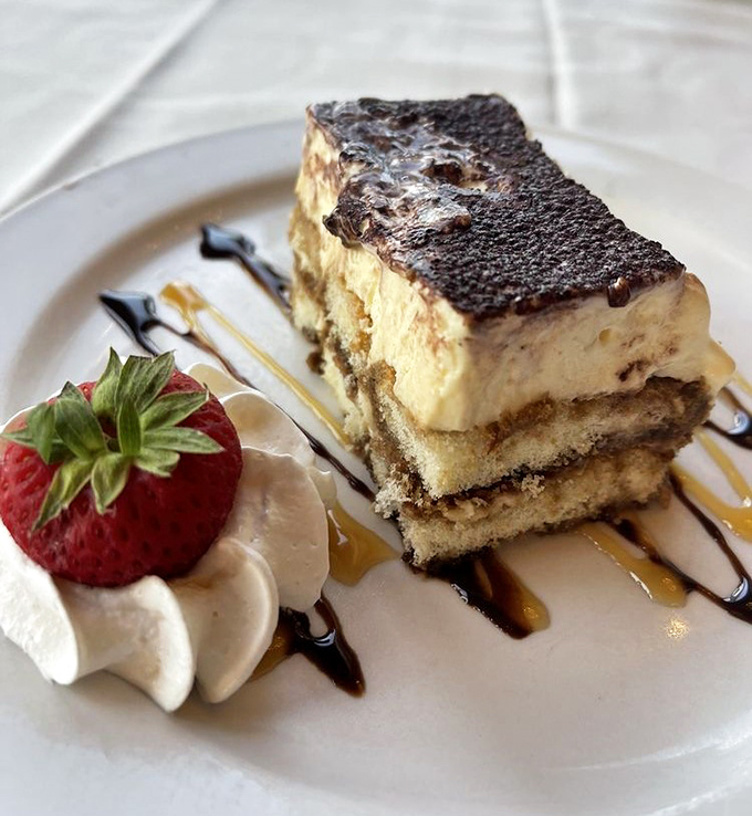 Tiramisu that strikes the perfect balance between cake and cloud. The strawberry isn't garnish &ndash; it's a necessary palate cleanser.