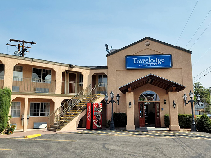 The Travelodge stands ready for weary travelers&mdash;a humble reminder that sometimes all you need is a clean bed and a Coca-Cola machine.