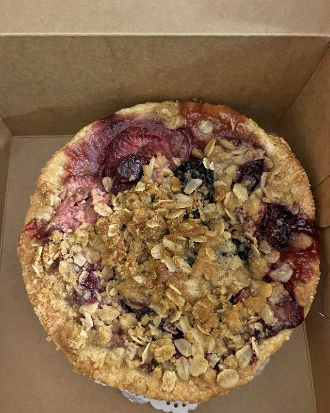 This triple berry mini pie isn't playing fair&mdash;the crumble topping, the glistening berries, the perfectly crimped crust. Resistance is futile.