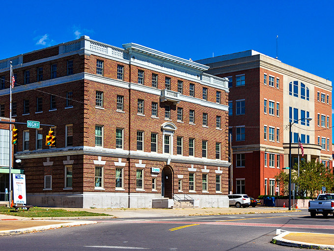 The Trumbull County Building's solid brick presence anchors the street corner with the quiet confidence of institutional permanence.