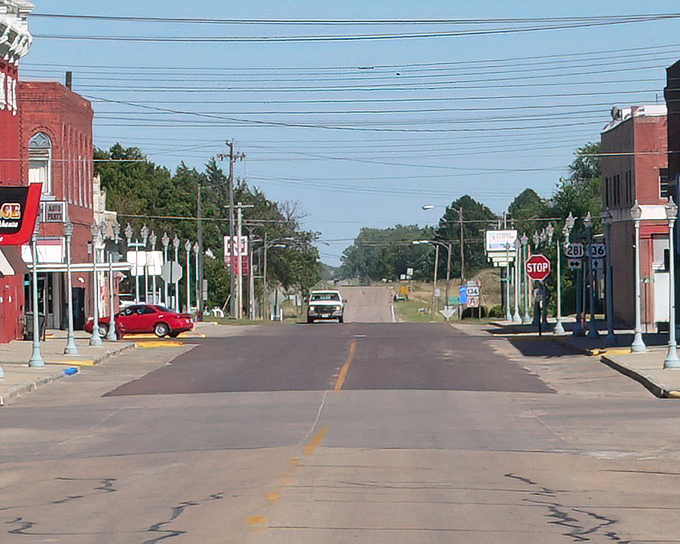 U.S. Highway 136 stretches toward the horizon, a reminder that Red Cloud sits at the crossroads of literary history and rural American life.