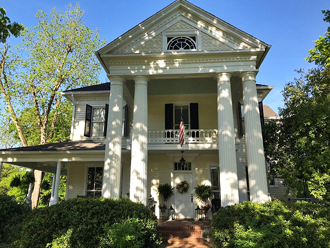 This Greek Revival home stands as testament to an architectural era when columns weren't just structural supports but fashion statements.