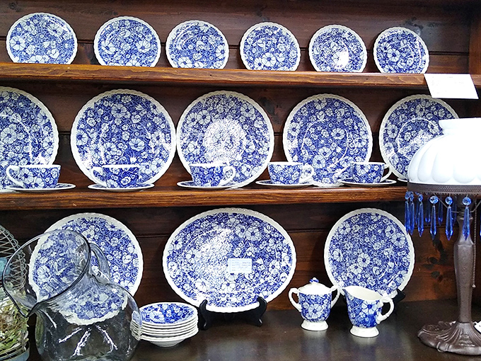 Blue and white china displayed with museum-worthy precision. Your grandmother would approve of these timeless pieces that never go out of style.