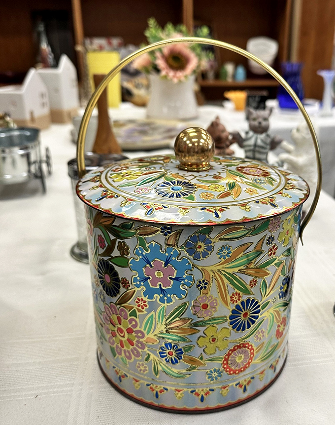 This ornate tin container once held cookies or sewing supplies in someone's grandmother's house. Now it awaits your creative repurposing.