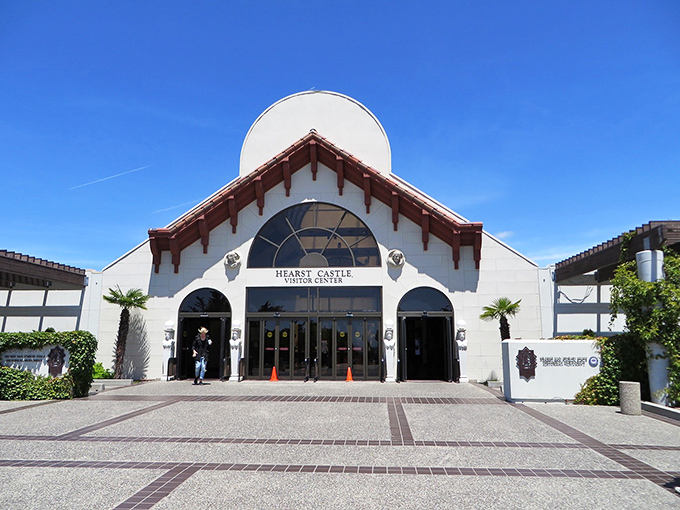 The visitor center welcomes you with Spanish-inspired architecture, preparing you for the opulence that awaits up the winding hillside road.