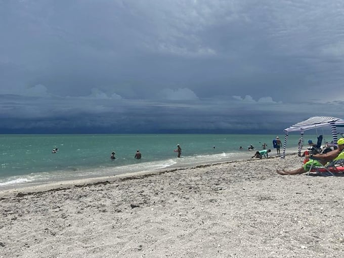Beach umbrellas dot the sand like colorful mushrooms after a particularly festive rain.