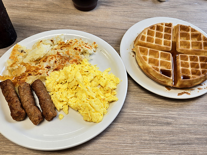 A breakfast trinity that would make any morning better&mdash;golden waffle, scrambled eggs, and sausage links that snap with that perfect first bite.