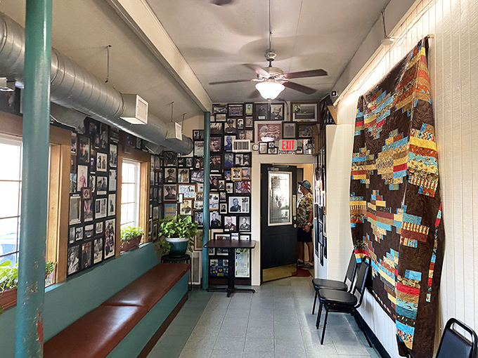 The waiting area's walls tell Fort Worth's story through photographs, while a colorful quilt adds a touch of homespun warmth.