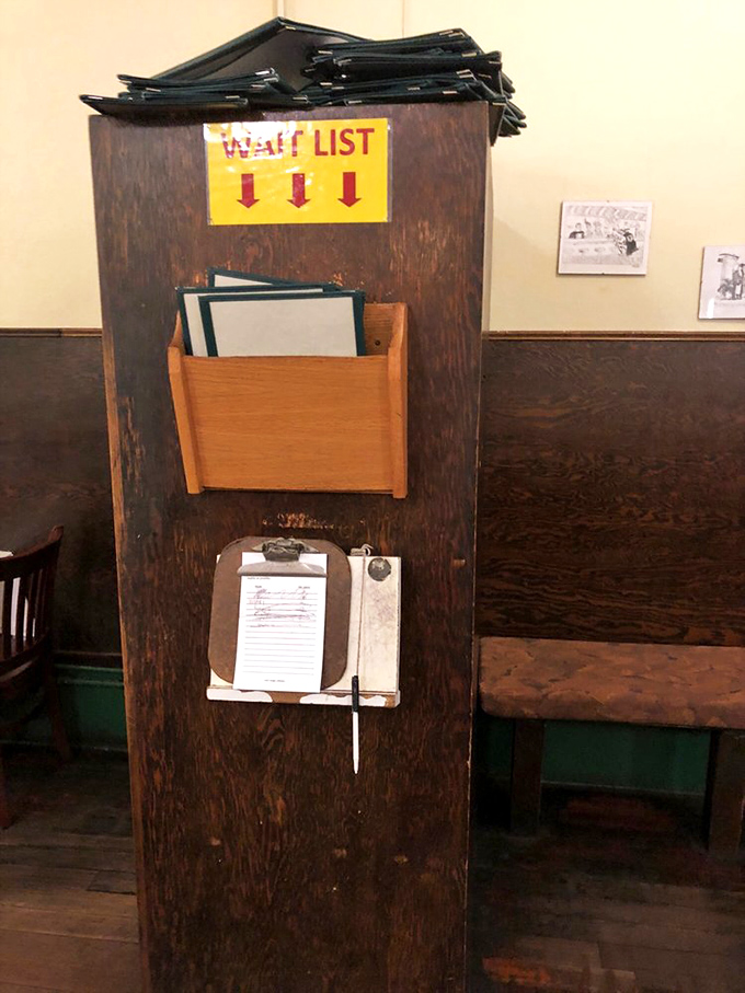 The wait list station&mdash;where hope lives on a clipboard and patience is rewarded with the promise of sourdough pancakes to come.
