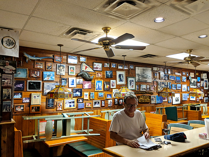 The wall of memories tells stories of epic catches and happy diners &ndash; a community built around great seafood.
