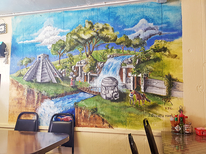 Colorful murals and family photos transform plain walls into a vibrant celebration of local culture.