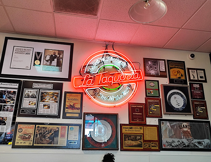 That neon sign illuminates more than just a wall&mdash;it's a lighthouse for food pilgrims seeking authentic flavors in a sea of pretenders.