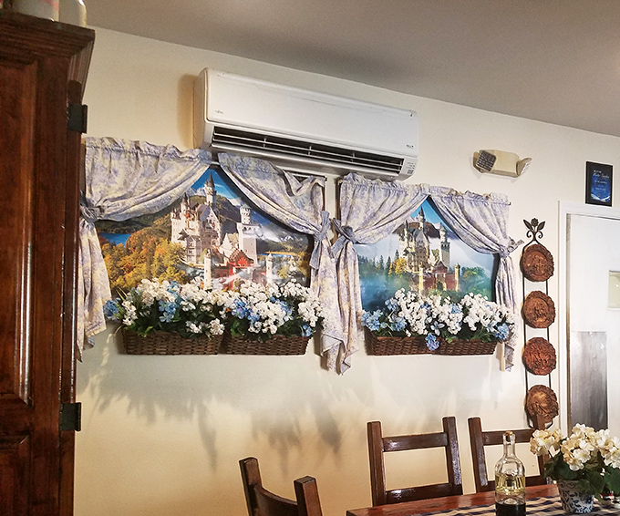 Even the wall decorations tell a story, with scenes of German castles and flower boxes that transport you straight to the Alps.