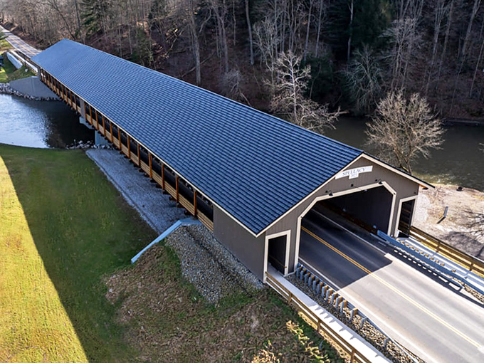 Bird's eye perfection! This aerial view showcases the covered bridge's impressive span, a testament to both engineering prowess and aesthetic charm.