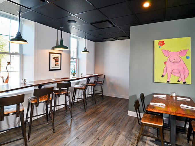 Window seats and pig art create the perfect backdrop for contemplating life's important questions – like "Should I order more brisket?"