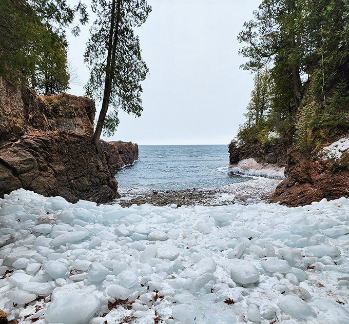 Winter transforms Black Rocks into a frozen wonderland where ice sculptures meet ancient stone.
