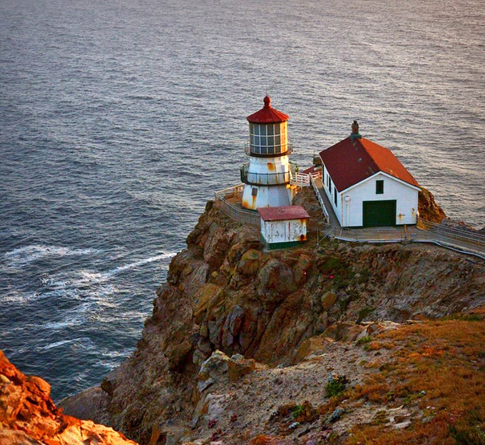 Perched on the edge of America like a postcard come to life, the lighthouse and its companion building seem to defy gravity itself.