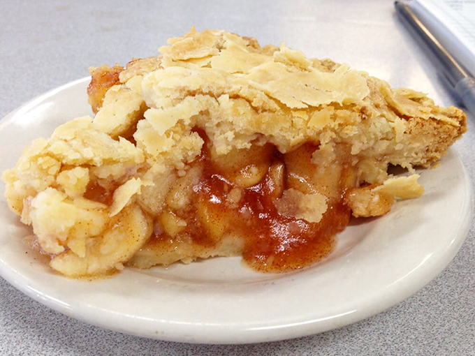 Apple pie that makes you understand why people write songs about it. The crust has that homemade imperfection that signals authentic deliciousness.