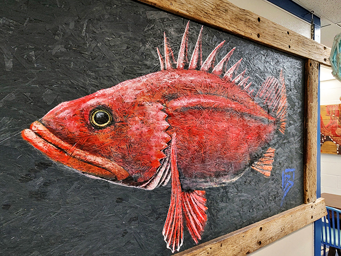 This isn't just fish art &ndash; it's a crimson rockfish portrait with personality, framed in weathered wood that's probably seen as many storms as the fish it depicts.