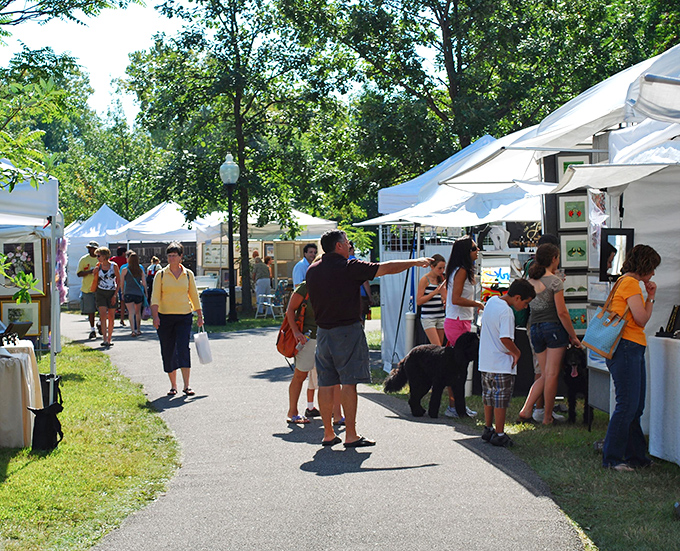 Hudson's art festival transforms the green into an outdoor gallery where conversations flow as freely as creativity.
