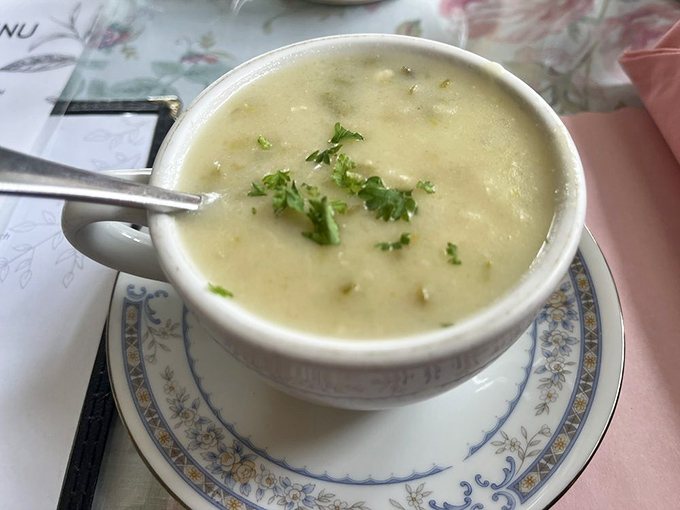 Soup so elegant it arrives wearing fresh herbs like jewelry &ndash; comfort food dressed for a garden party.