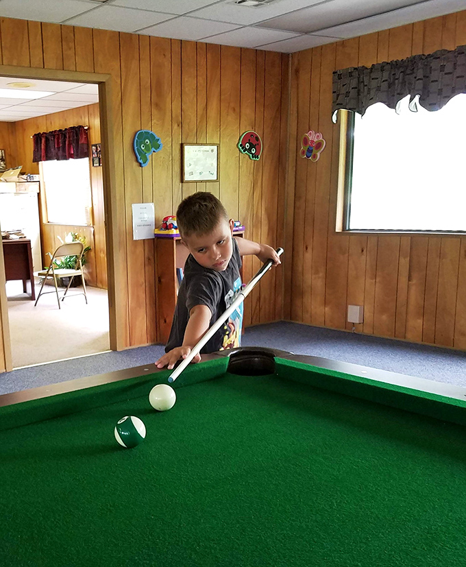 Future pool shark in training! Rainy days at camp become memory-makers with indoor games and friendly competition.