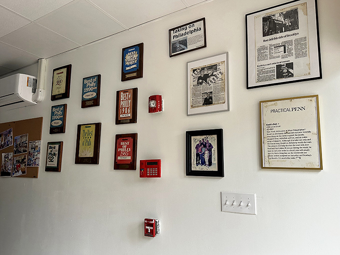 Wall of fame and flavor. Awards and newspaper clippings tell the story of Koch's impact on Philadelphia's food scene over the decades.