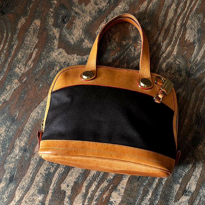 This two-tone leather handbag isn't just an accessory&mdash;it's a statement piece with stories to tell and new adventures to accompany.