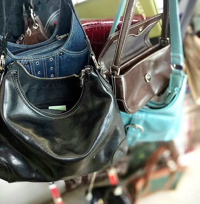 The handbag corner: where genuine leather treasures hide among their vinyl cousins, waiting for the discerning eye of a bargain-hunting fashionista.
