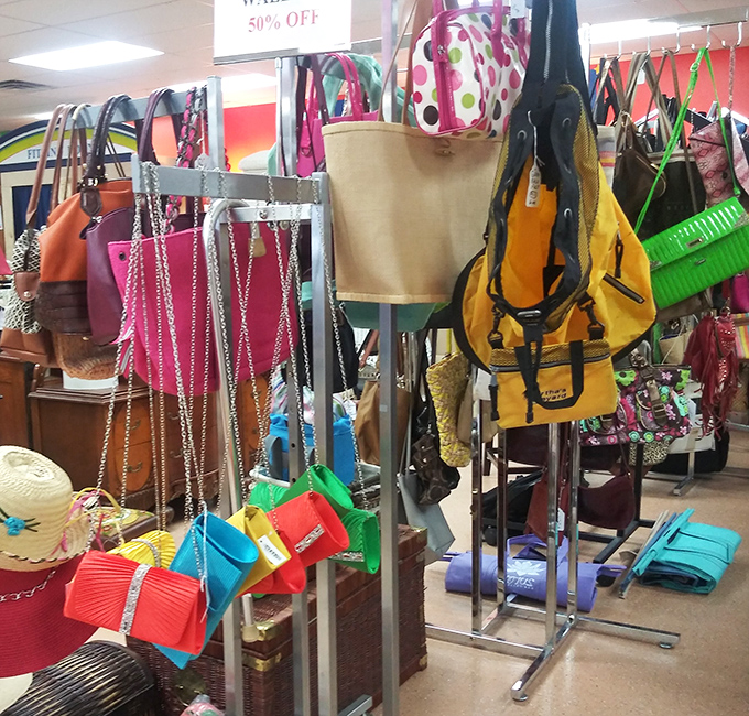 Handbag heaven! Designer-inspired totes and colorful clutches hanging like fashionable fruit ready to be plucked by savvy shoppers.