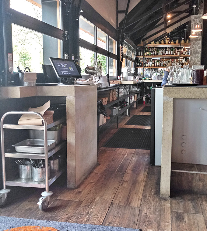 A bar that promises good times and great drinks, with enough bottles to ensure your pizza has the perfect liquid companion.