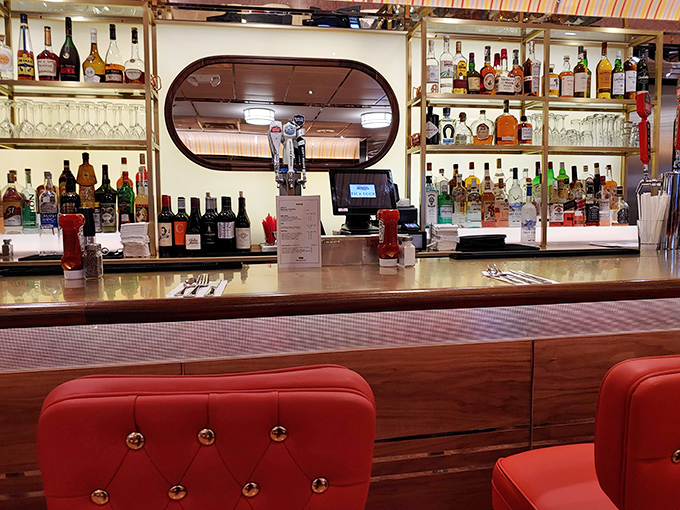 The bar area isn't just serving drinks—it's offering liquid courage with a side of nostalgia in an atmosphere that makes strangers feel like neighbors.