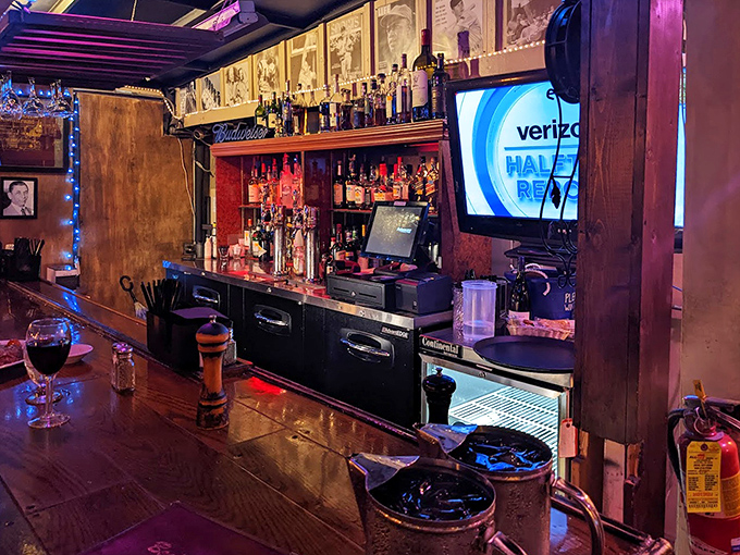 The bar area glows with amber warmth, promising stiff drinks and easy conversation. The kind of place where strangers become friends over shared bourbon recommendations.