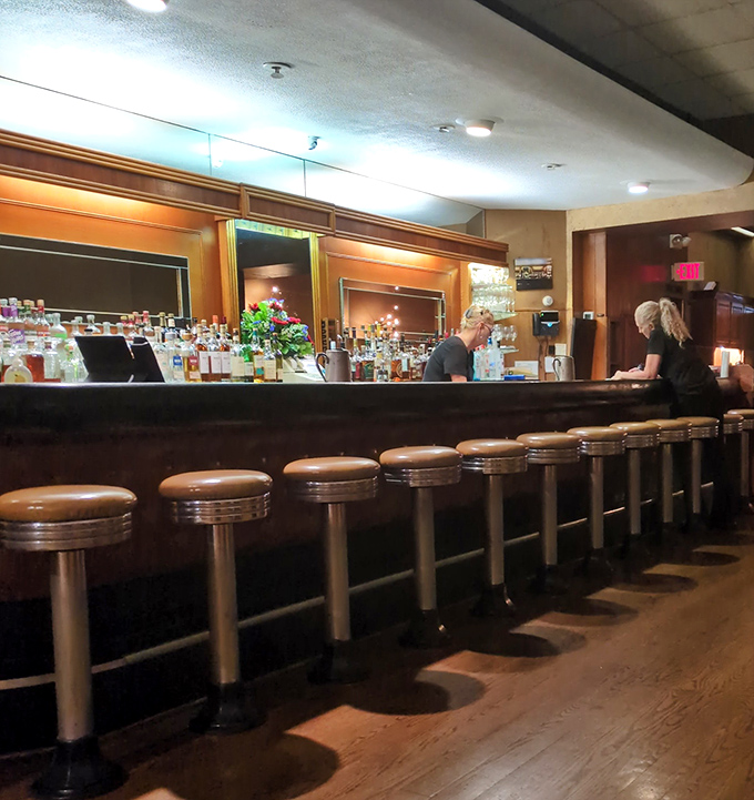 Bar stools that have supported generations of Akron's finest posteriors. This counter has heard more confessions than most church booths.